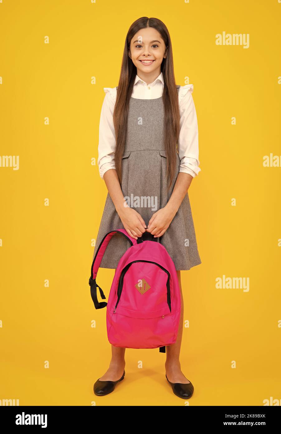 Back to school. Teenager school girl in school uniform with bagpack ...