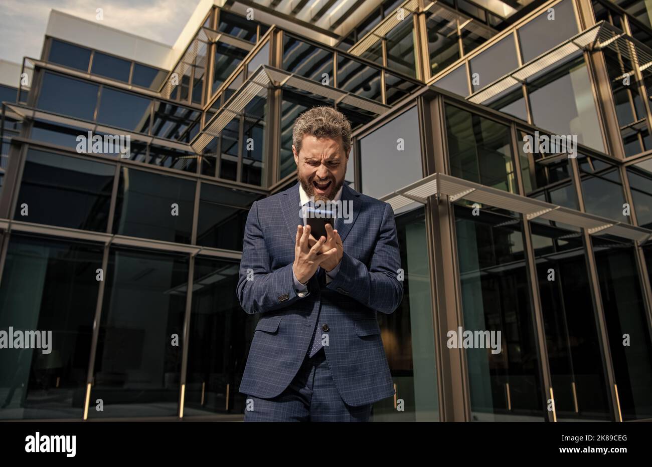 communication. shouting businessman hold smartphone. man boss has ...