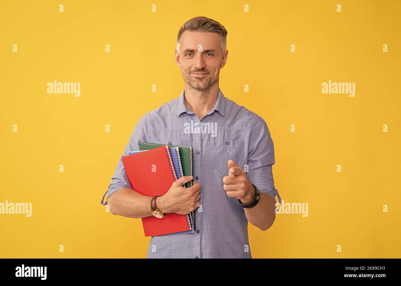 signing a contract. school teacher or university tutor. smiling man ...