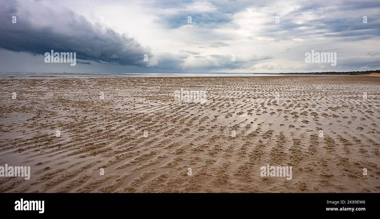 Sand flats of the intertidal zone of Pialba Beach, Queensland, at low ...