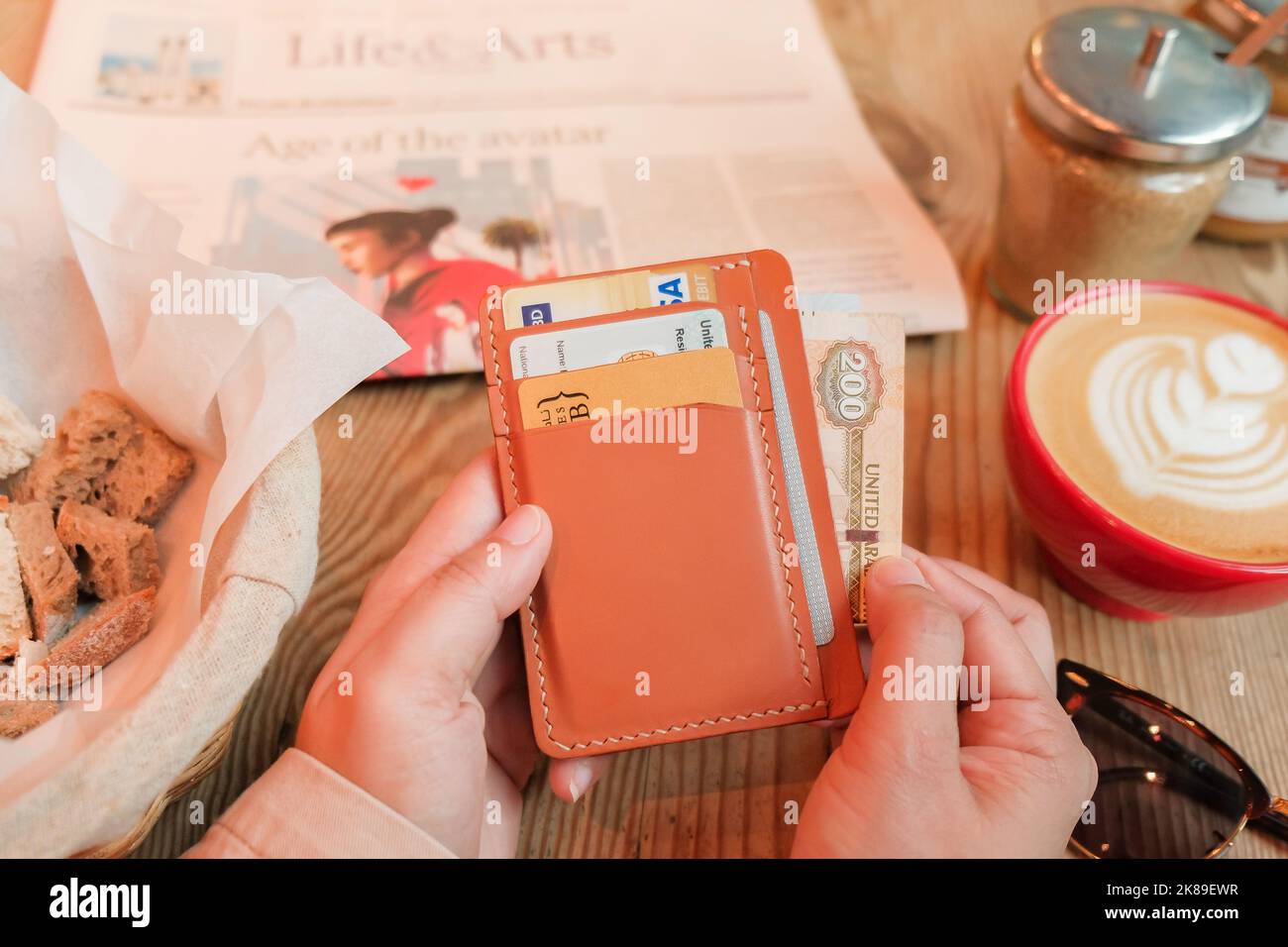 Money dirham hands hi-res stock photography and images - Alamy