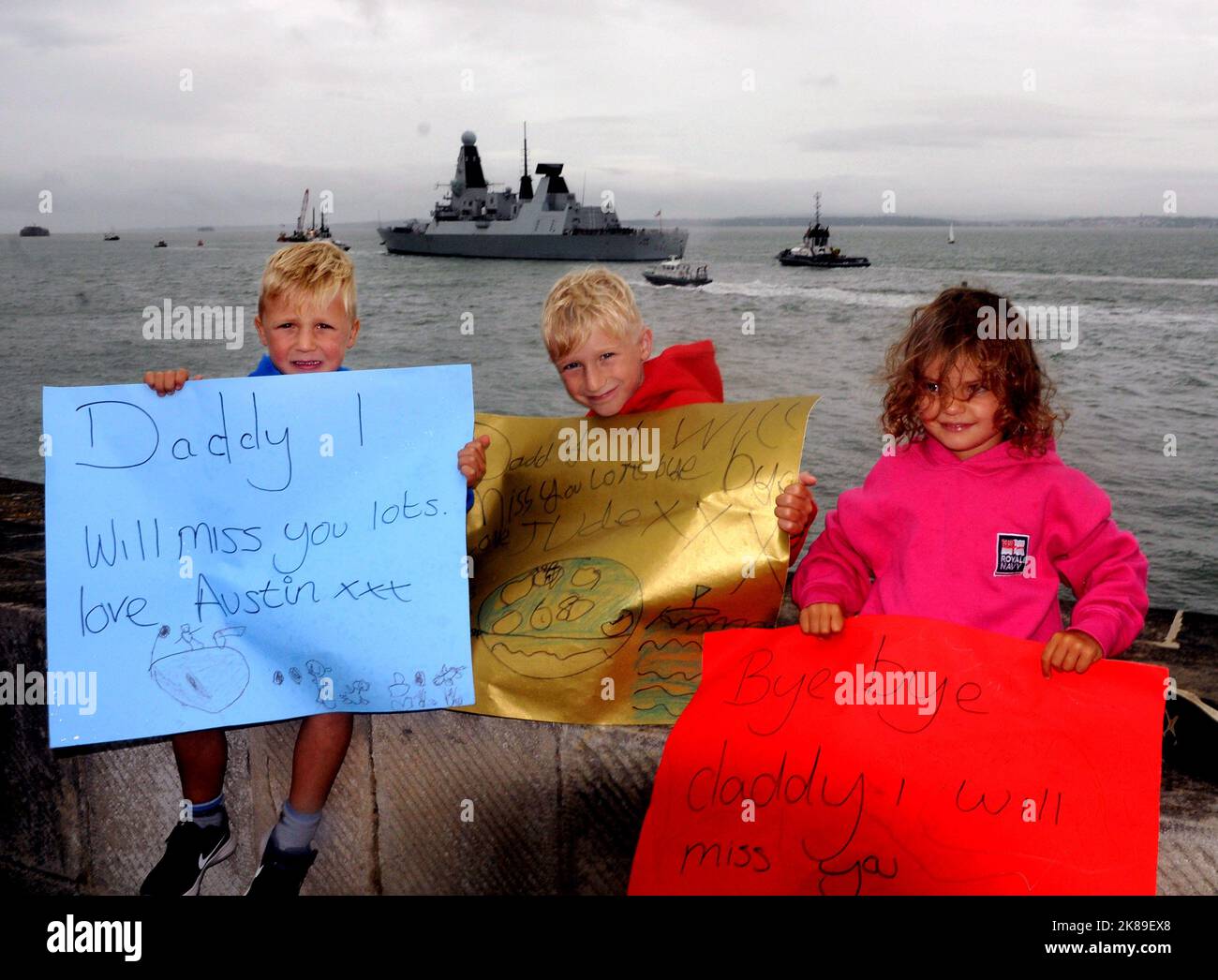 Jude Neslon,7, his brother Austin,5, and Katie Mobius,3, show off their ...