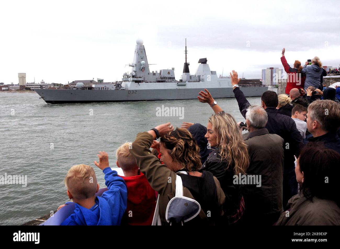 Crowds on the seafront at Portsmouth wave goodbye to the crew of HMS ...