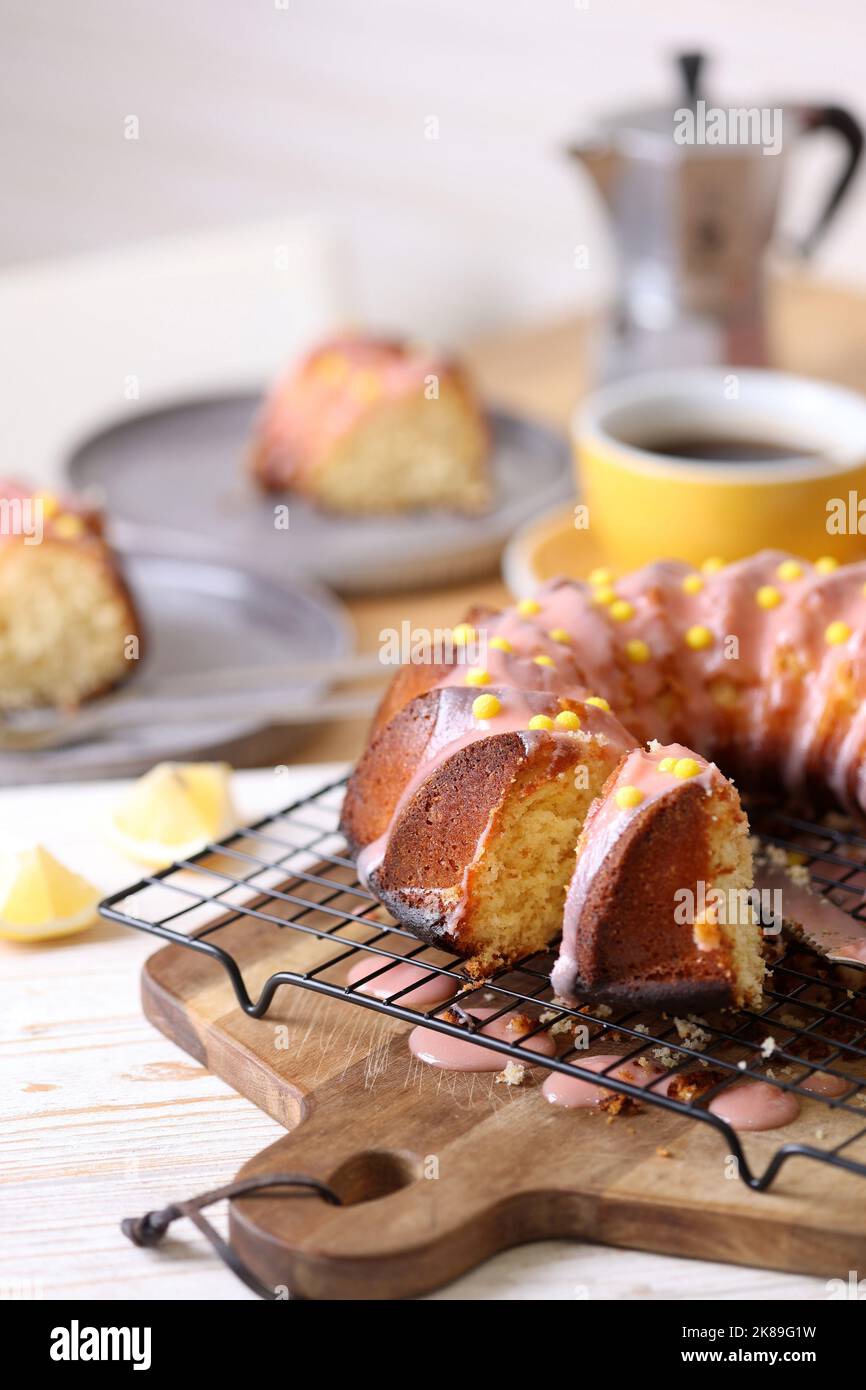bright birthday cake. delicious lemon cake with pink icing Stock Photo ...