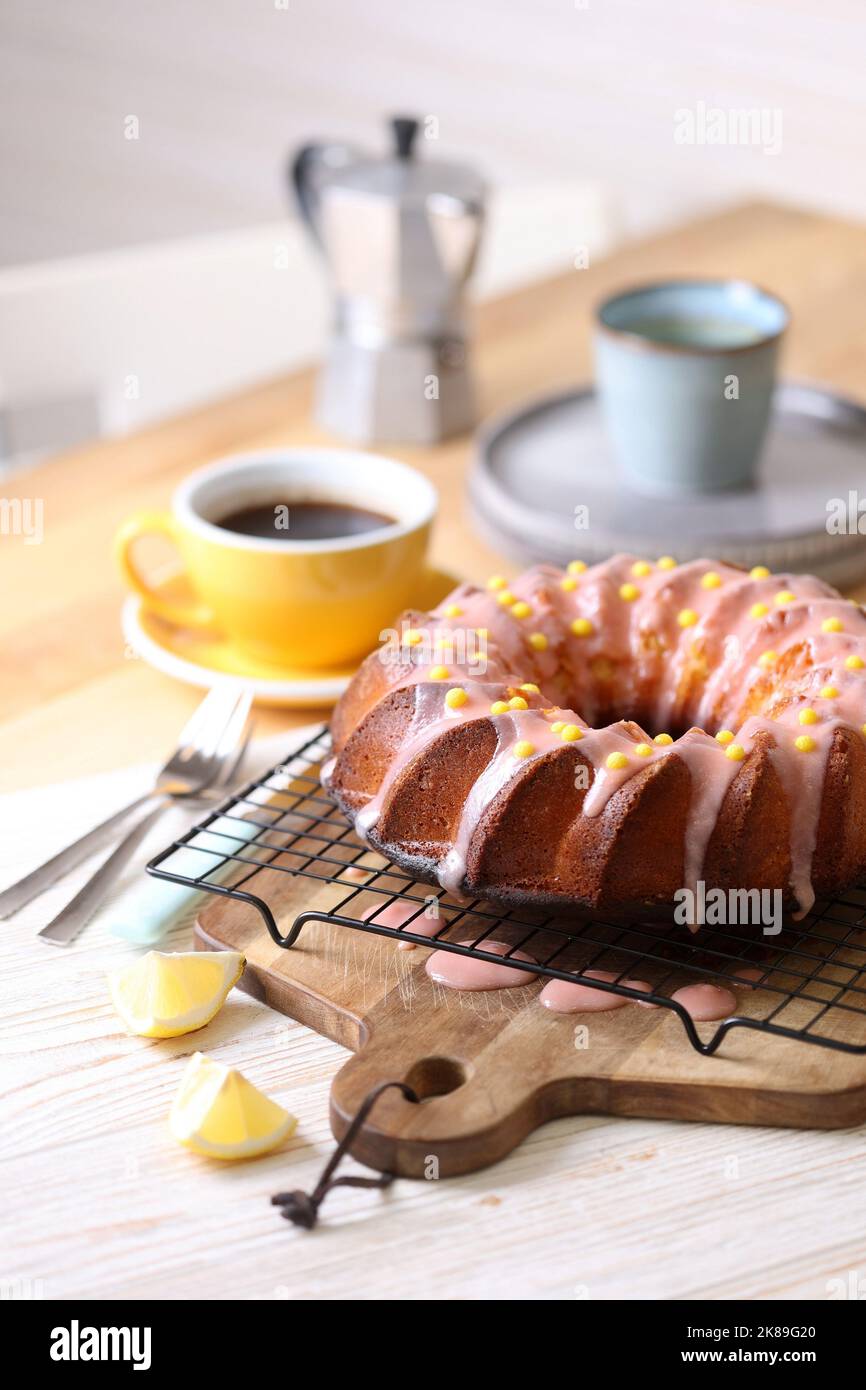 bright birthday cake. delicious lemon cake with pink icing Stock Photo ...