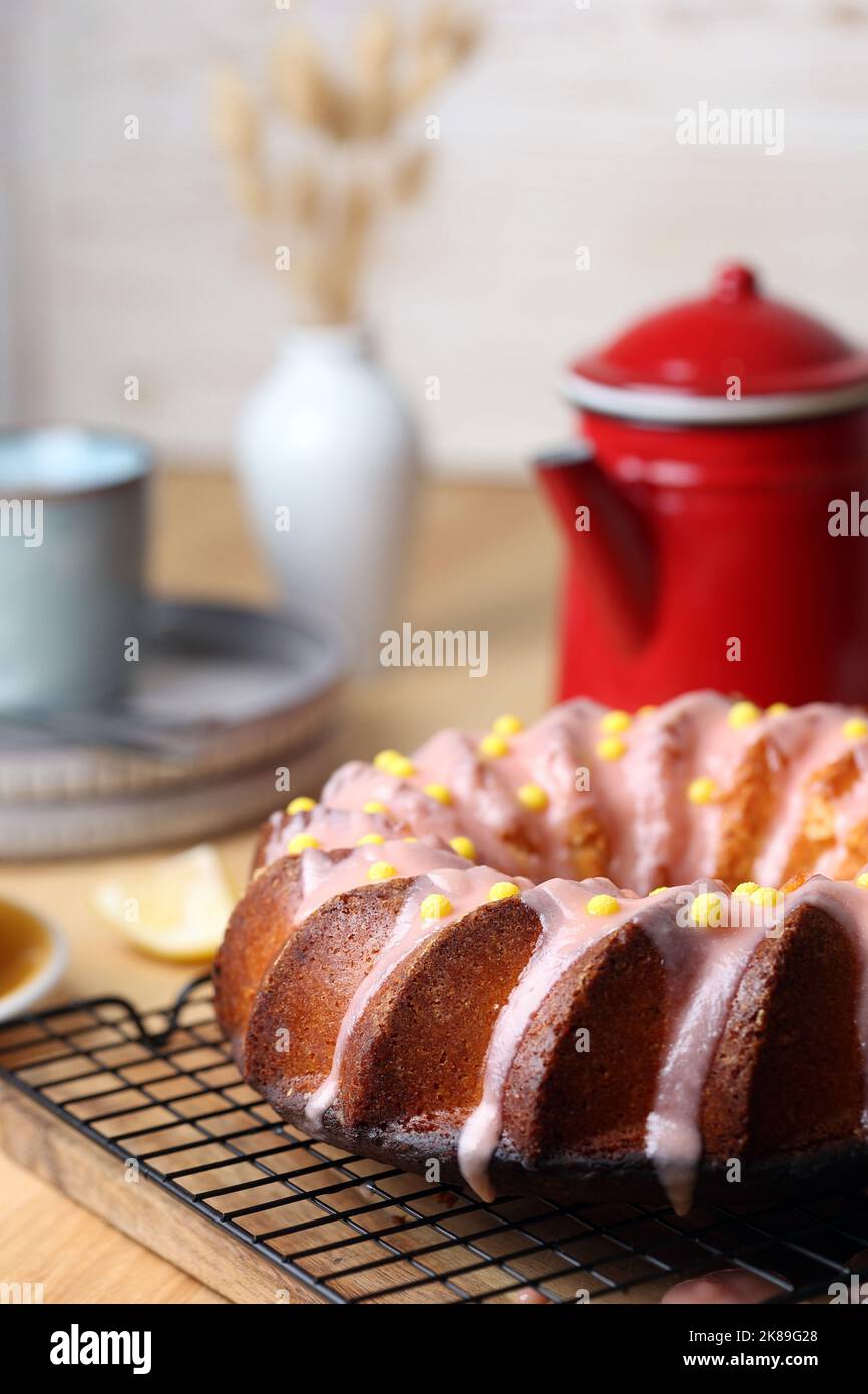 bright birthday cake. delicious lemon cake with pink icing Stock Photo ...