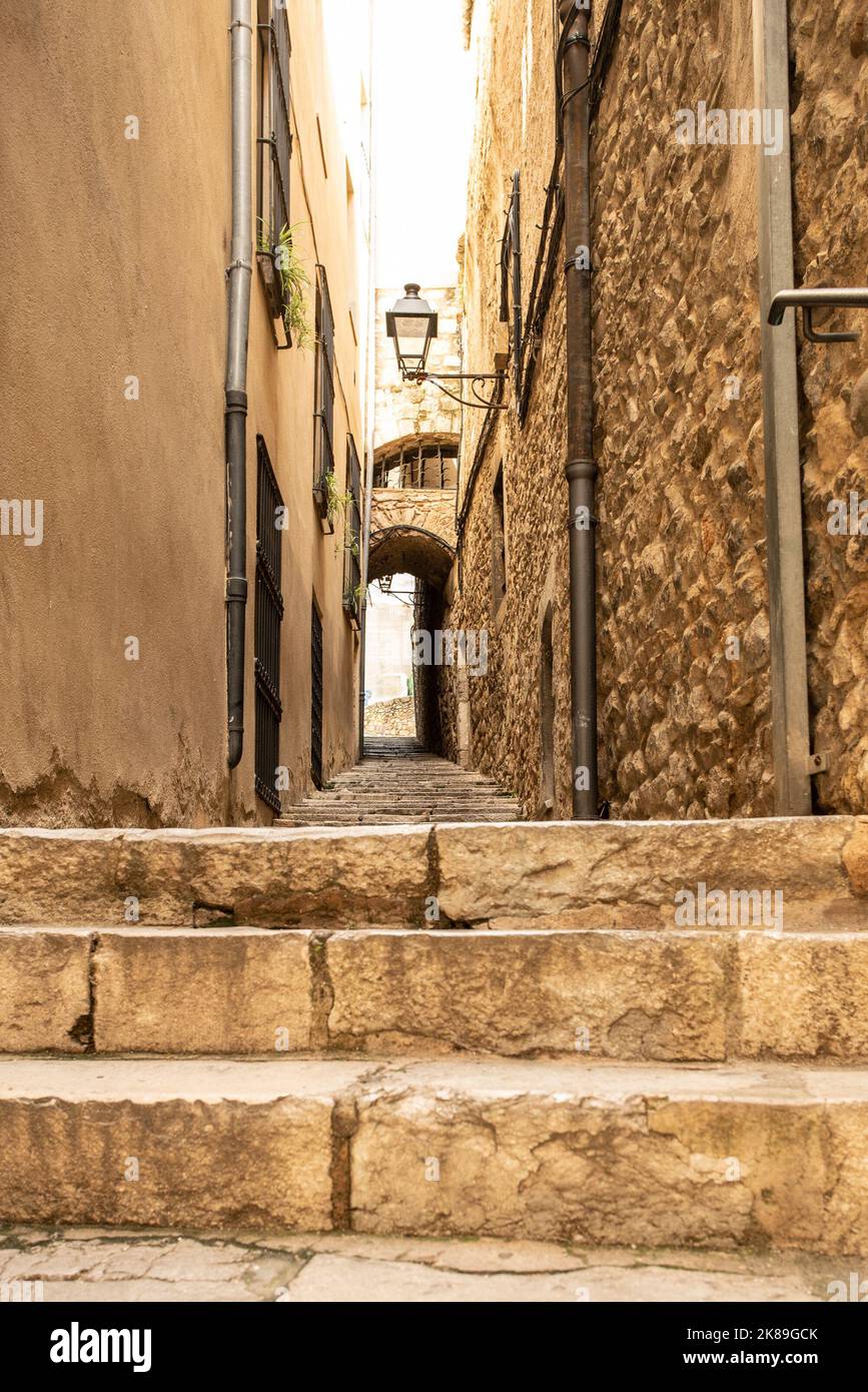 Old stone Ancient European medieval passageway alley with steps and ...