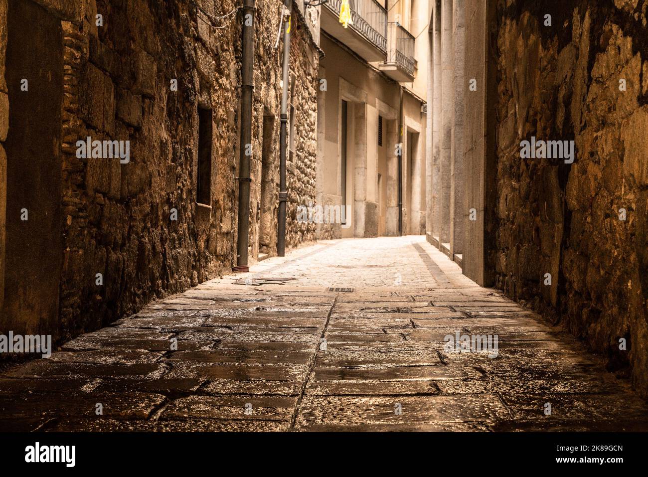 Old stone Ancient European medieval passageway alley with steps and ...