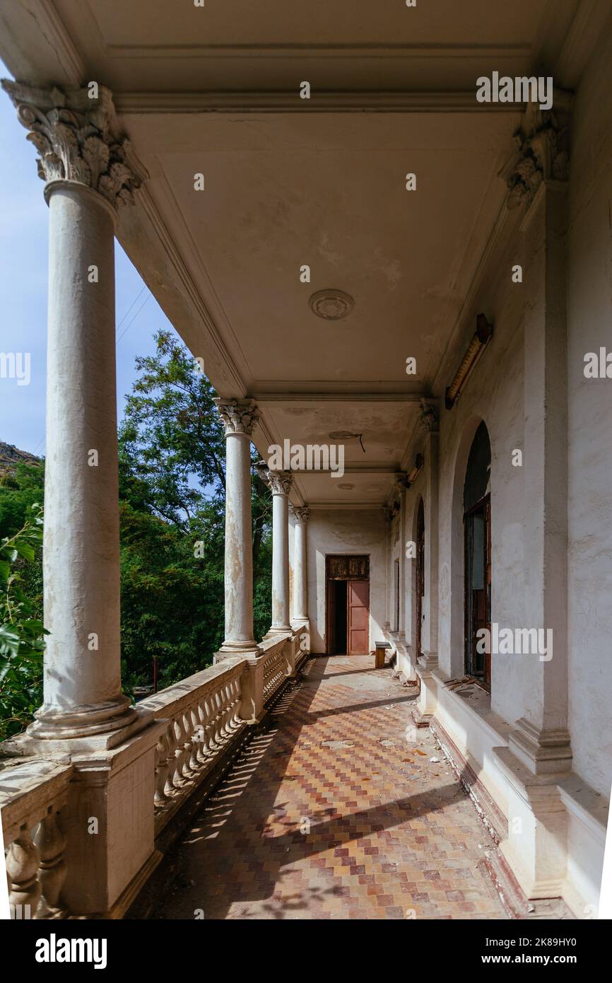 Old overgrown balcony of abandoned mansion Stock Photo - Alamy