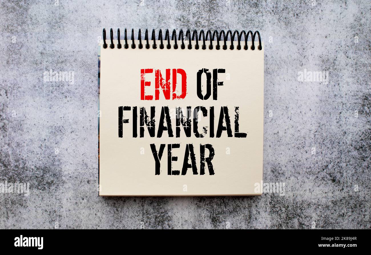 Financial Year text on paper sheet with magnifying glass on chart, dice ...