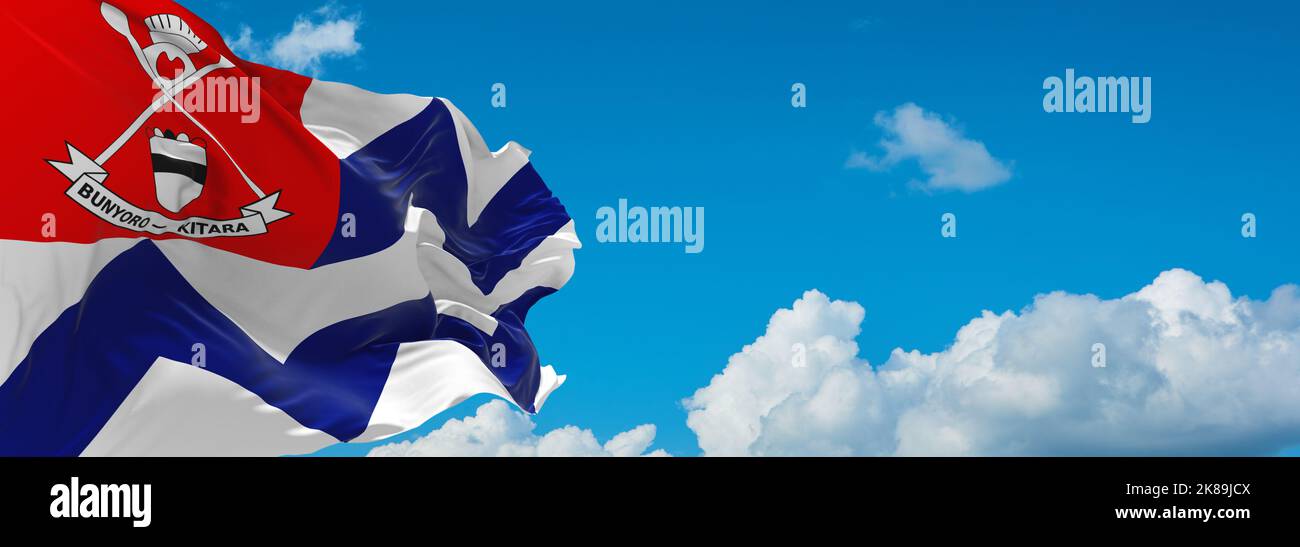 flag of Bantu peoples Nyoro people at cloudy sky background, panoramic ...