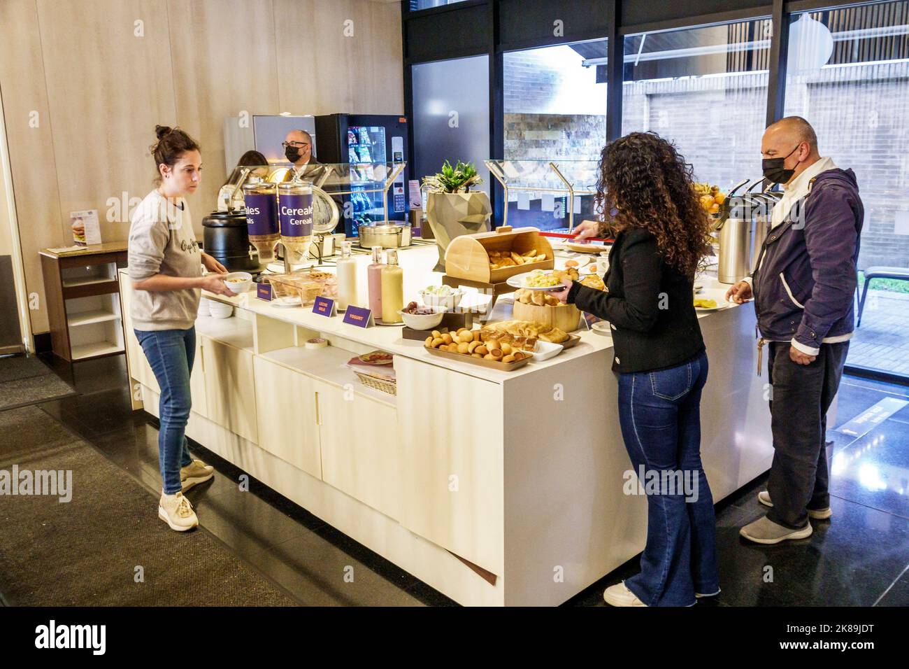 Woman women female self serve service buffet table bar hi-res stock ...