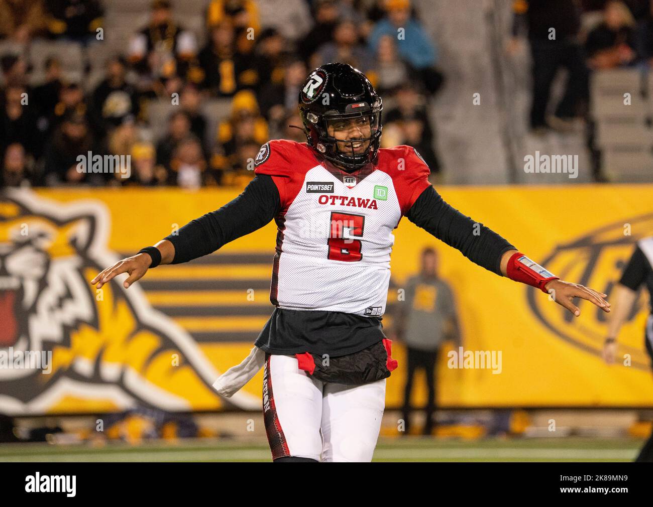 Ottawa Redblacks quarterback Caleb Evans (5) celebrates his touchdown ...