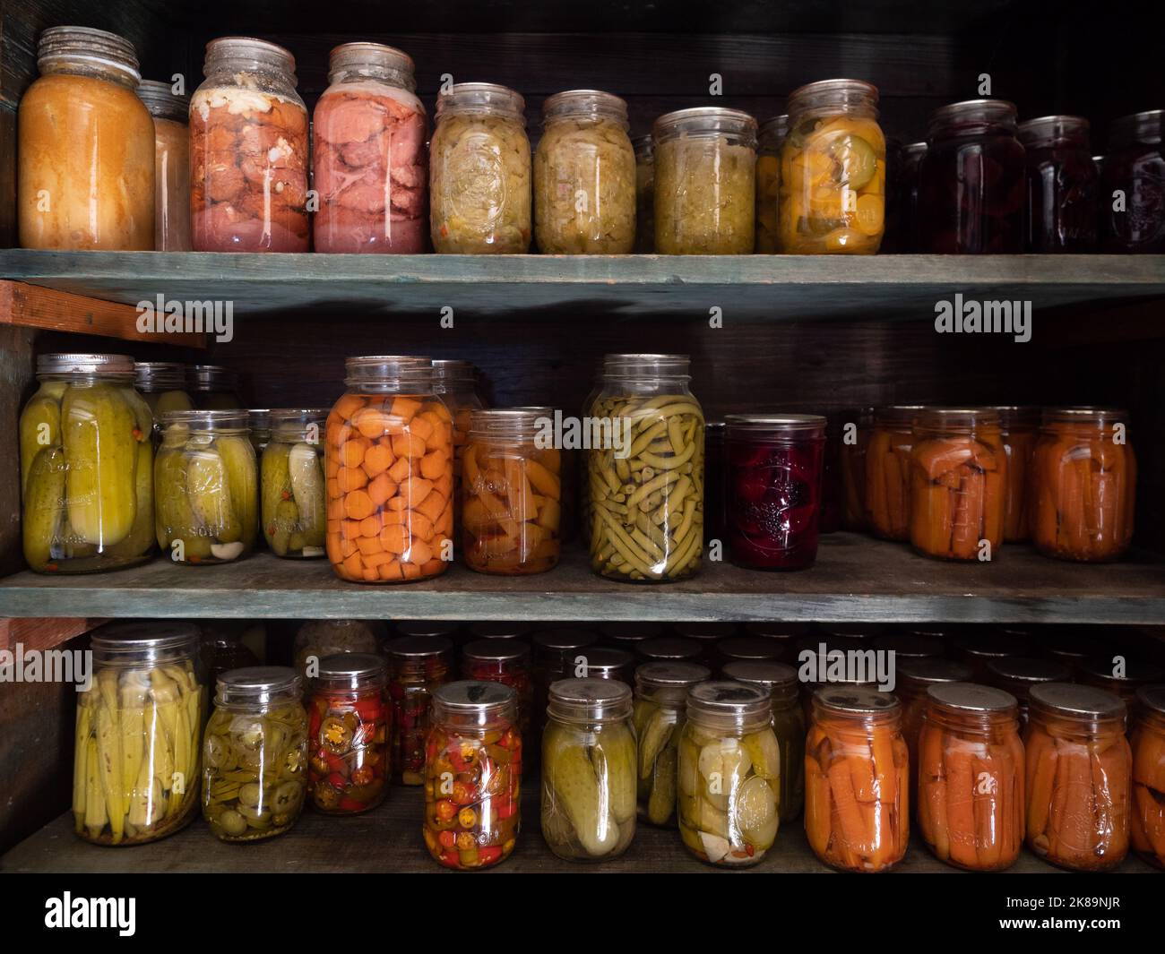 Wood shelves at the Sauer-Beckmann Living History Farm with home canned ...