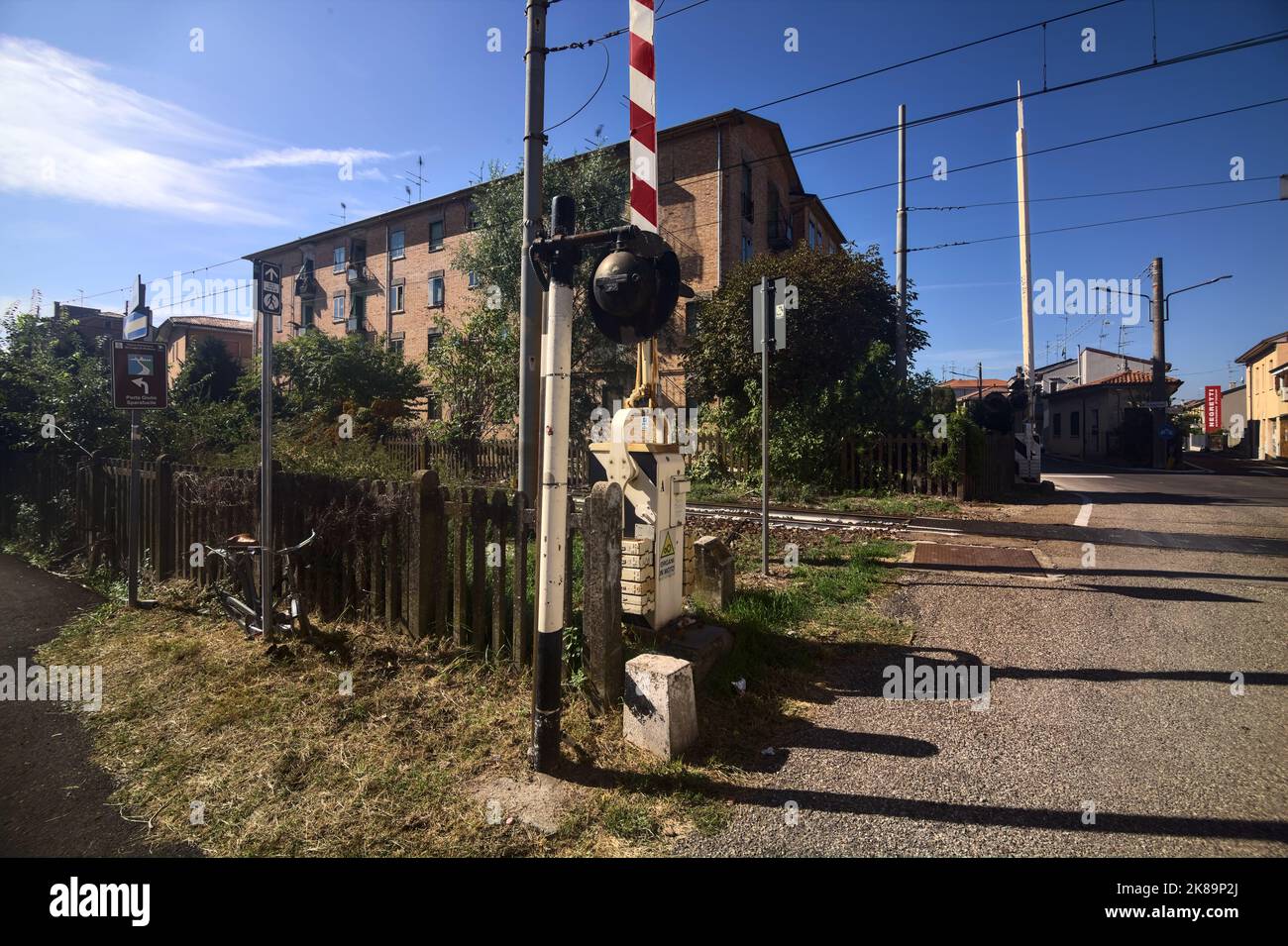 Railroad crossing in an italian town Stock Photo - Alamy