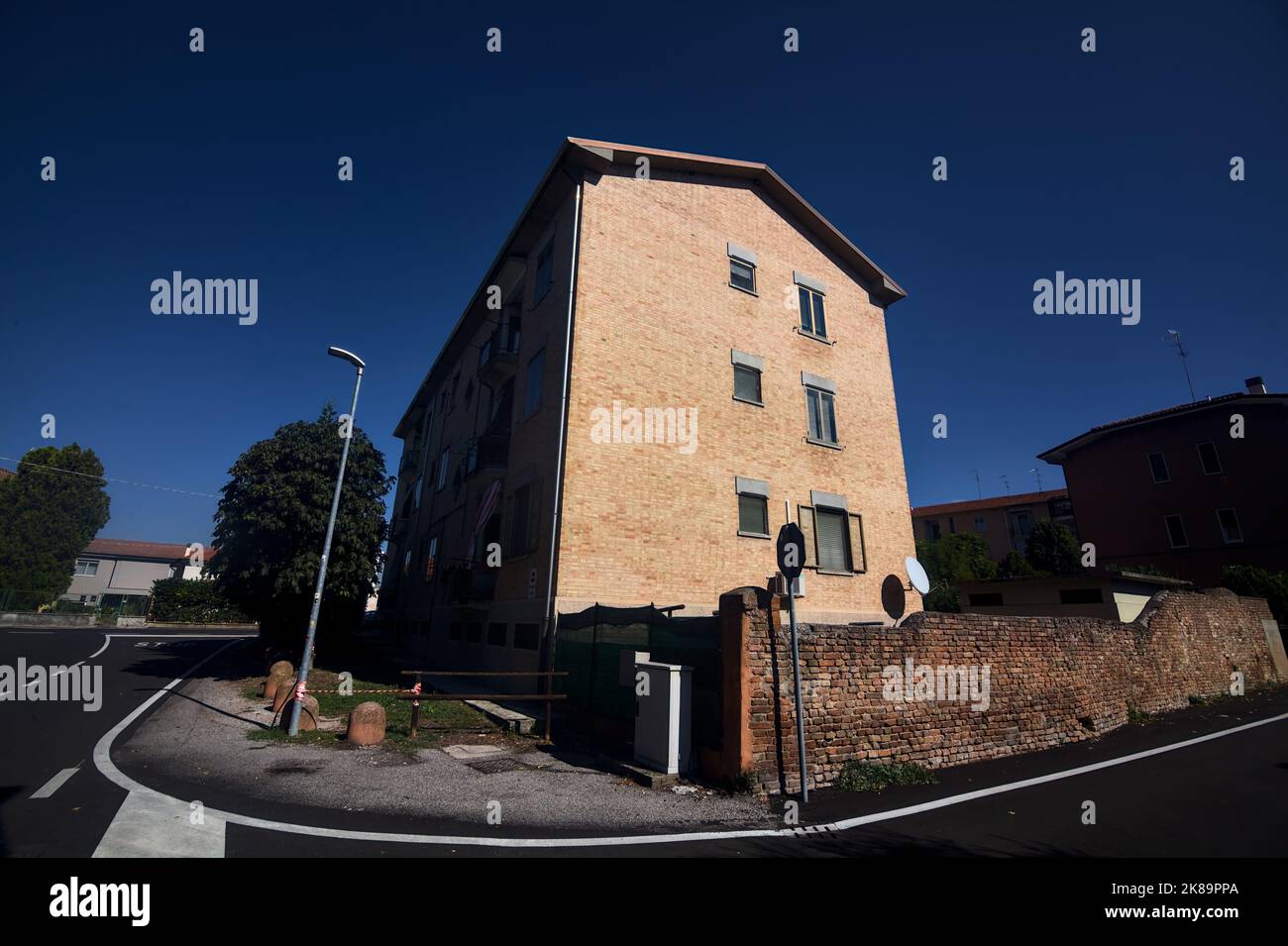 Corner of a street with stop sign on the ground in a residential area ...