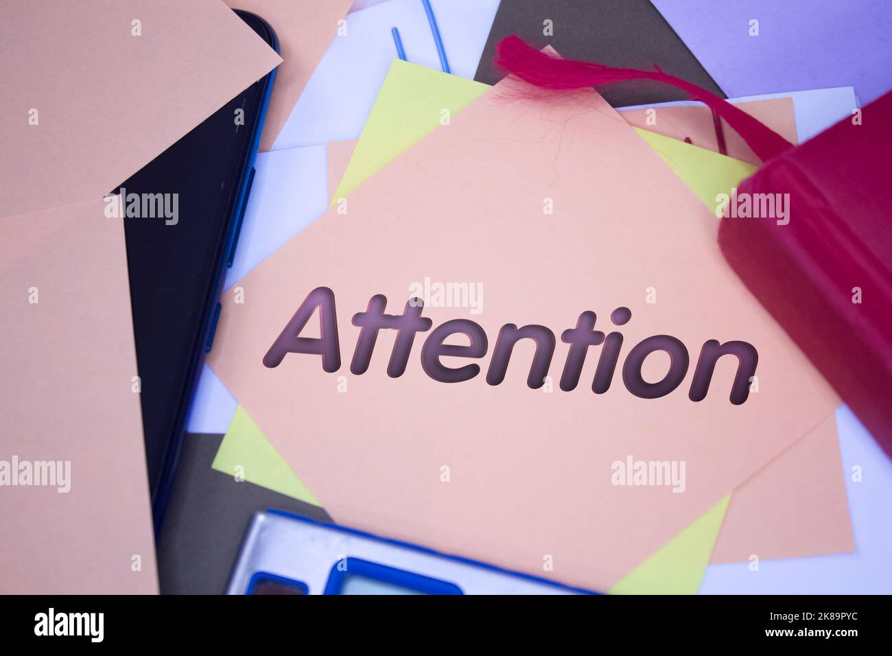 Attention. Text on adhesive note paper. Event, celebration reminder ...