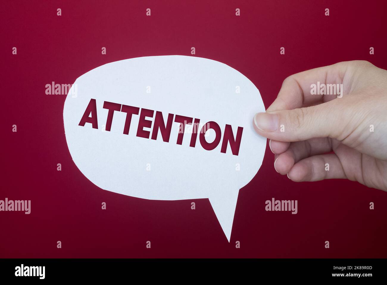 Speech bubble in front of colored background with Attention text Stock ...