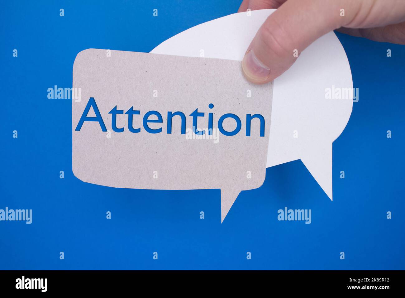 Speech bubble in front of colored background with Attention text Stock ...