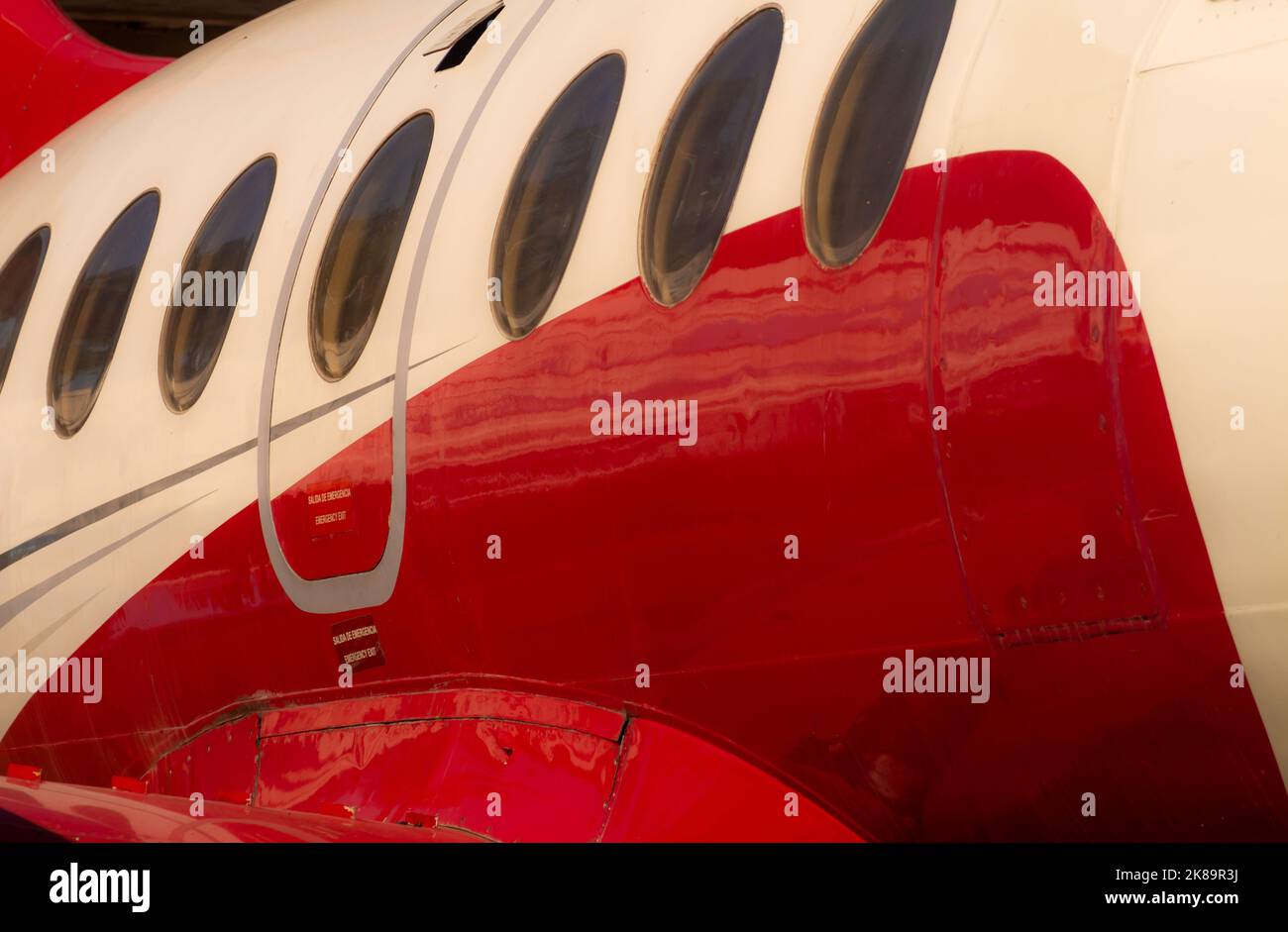 Old plane in disuse. Windows of an old plane. White and red plane Stock ...