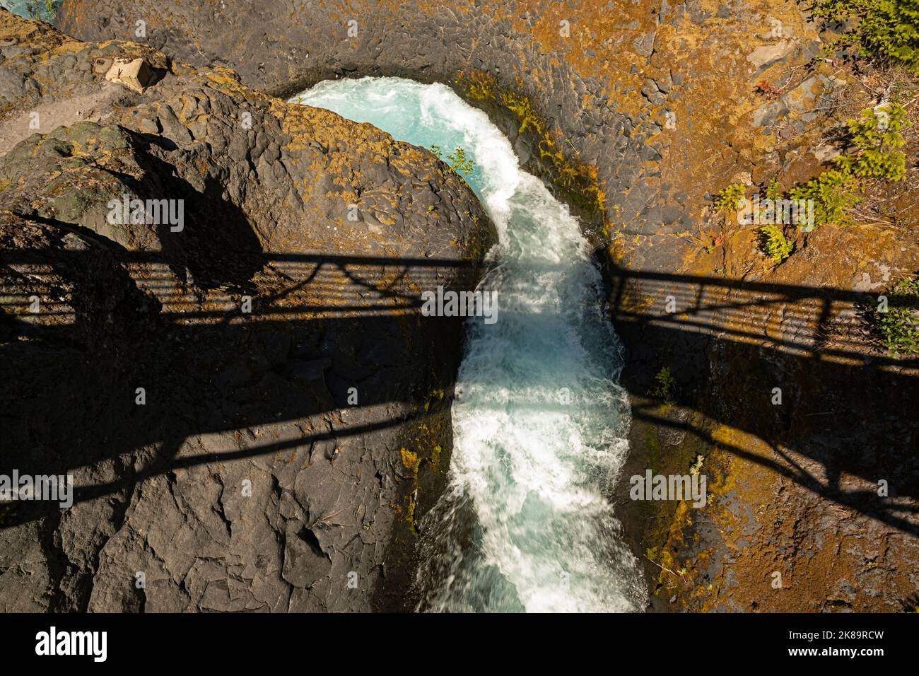 WA22503-00...WASHINGTON - Shadow of bridge across the Muddy River as it ...
