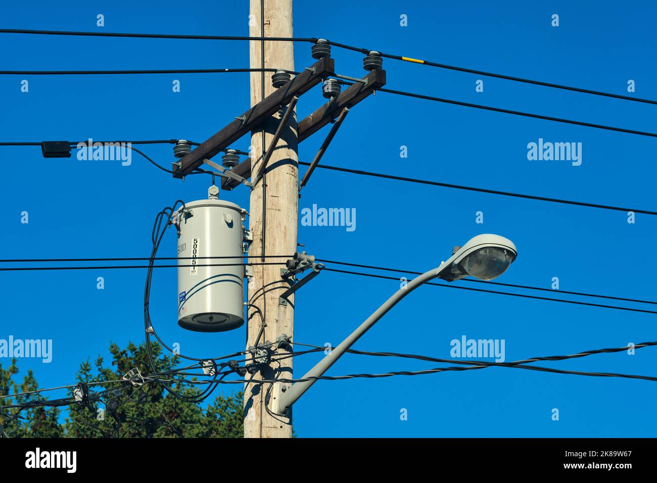 Electrical pole with a transformer and wires Stock Photo - Alamy