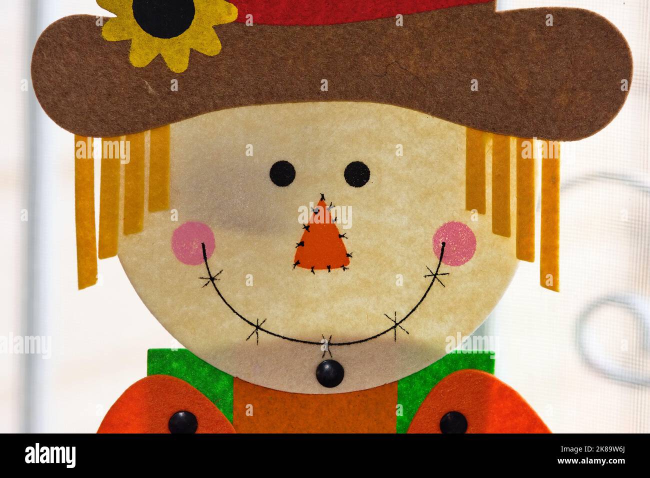 flat Halloween decoration picturing a friendly scarecrow is displayed ...