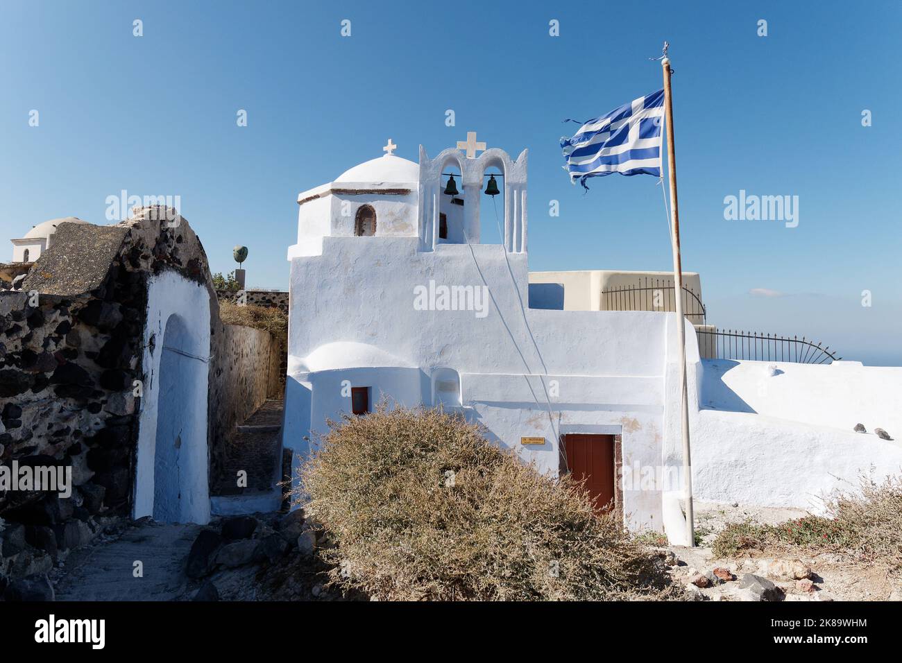 Church with Greek Flag in Pyrgos, the old capital of Santorini, a Greek ...