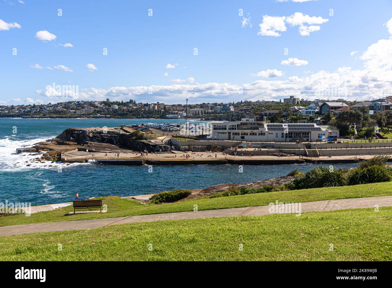 People sunbathing on the concrete at Clovelly Beach in Sydney ...