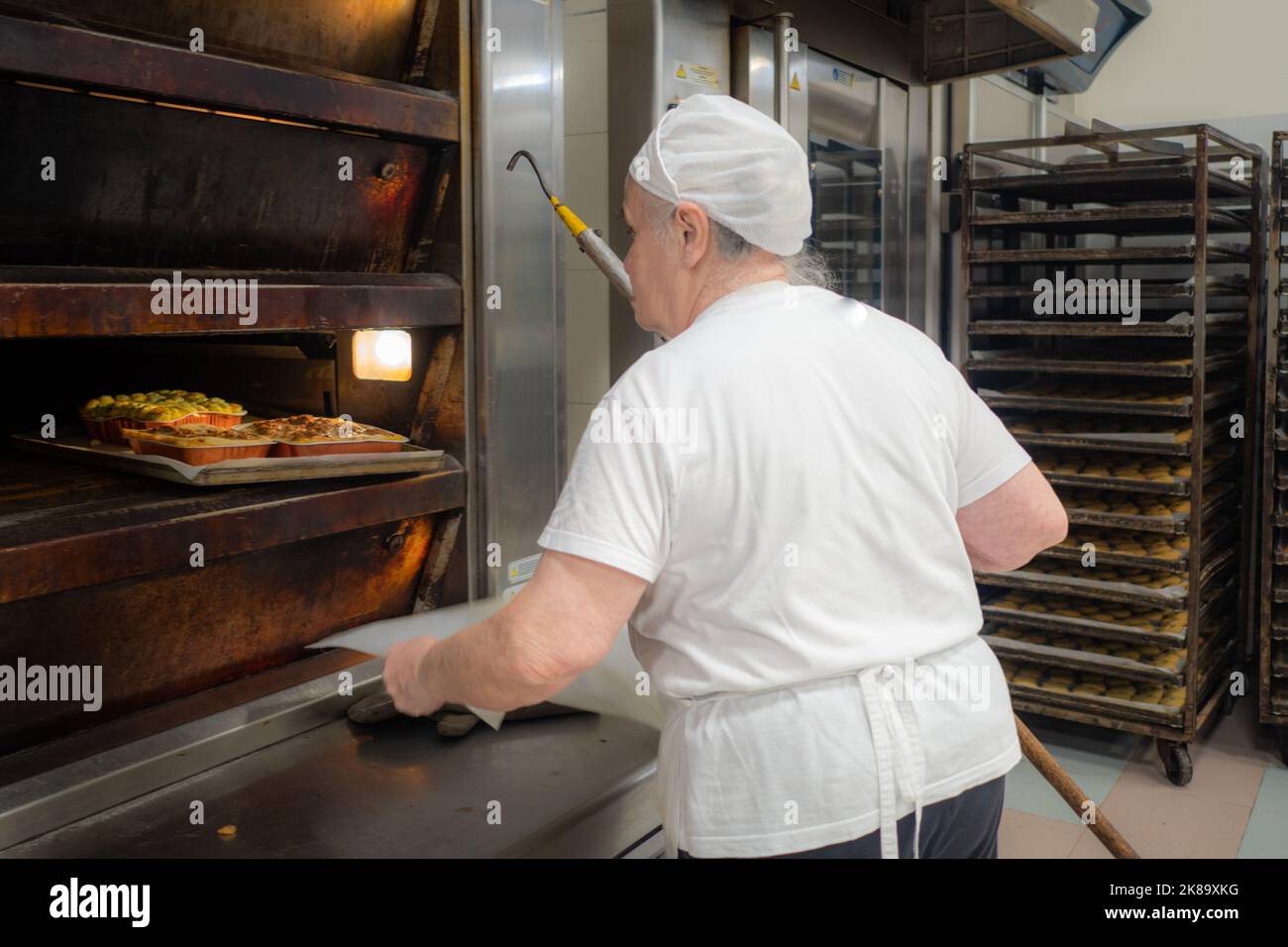 aged lady at work in big bakery restaurant Stock Photo - Alamy