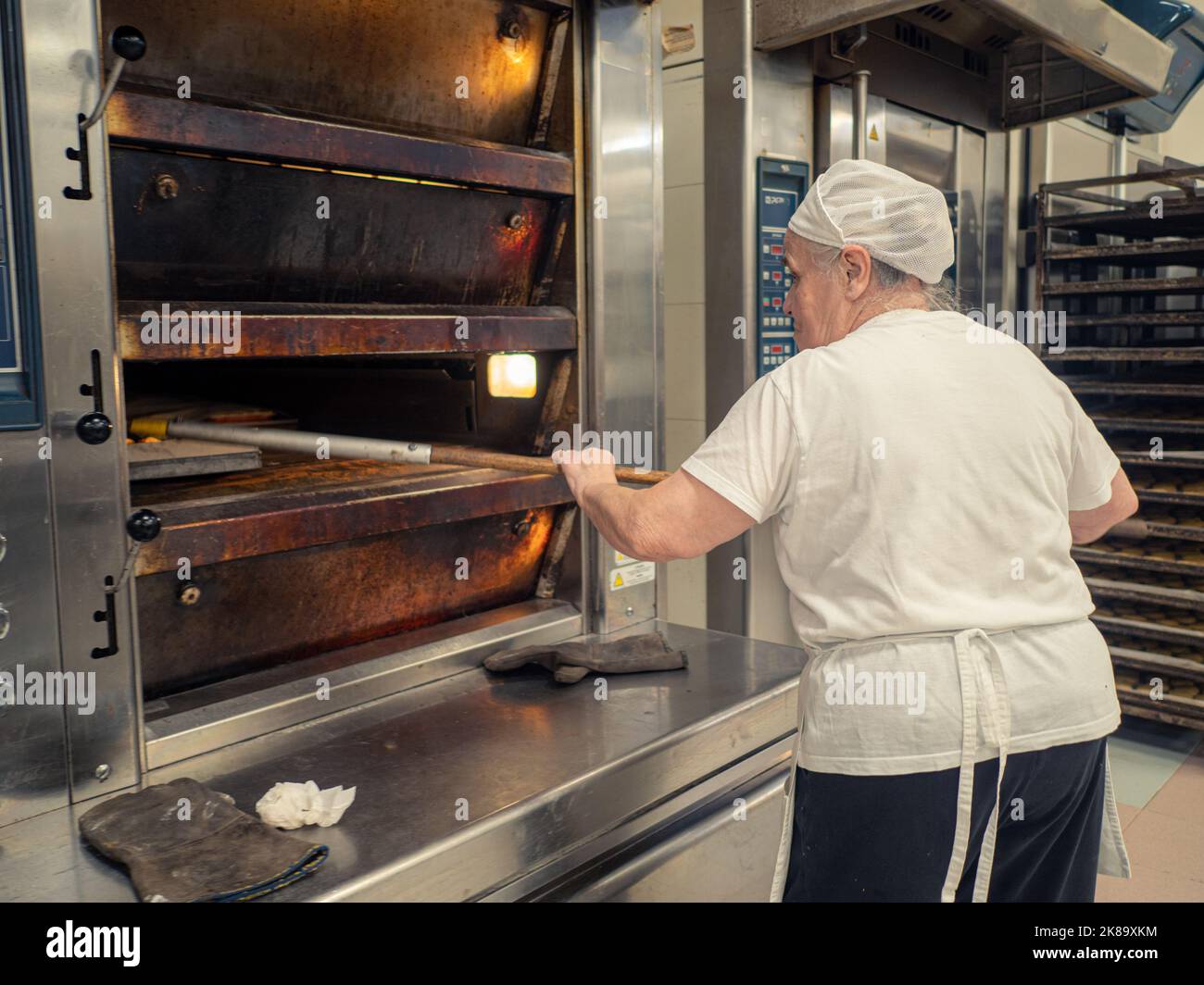 Lady work in big bakery hi-res stock photography and images - Alamy