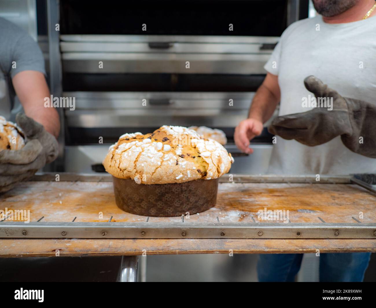 group of panettone cakes baking in the pro oven at the baker Stock ...