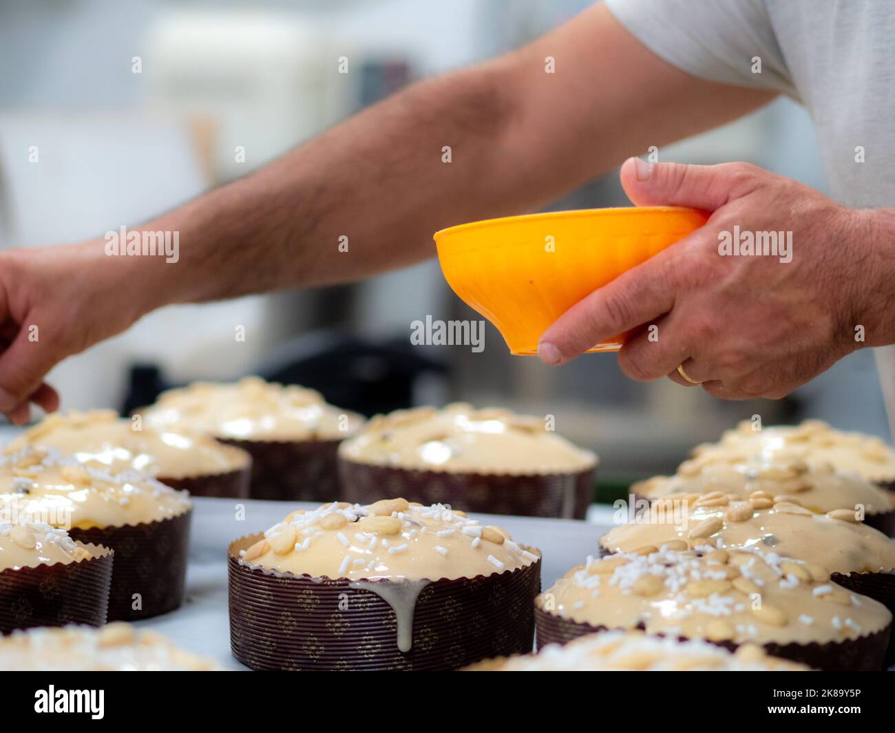 chef topping panettone italian cake with almonds Stock Photo - Alamy