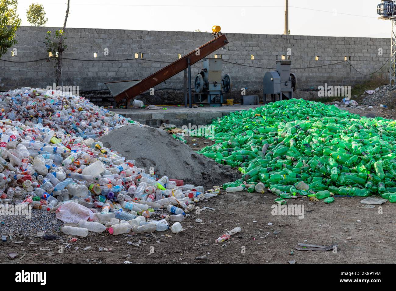 Plastic bottles waste in the factory for recycling Stock Photo - Alamy