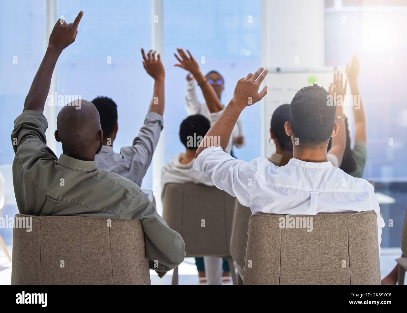 We hunger for knowledge. a unrecognizable group of people lifting their ...