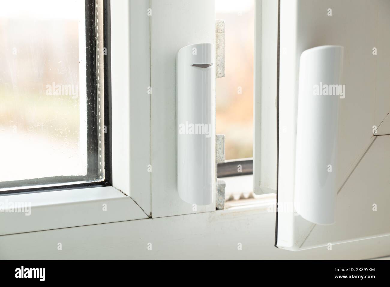 window opening sensor hanging on the window, home alarm system, home ...