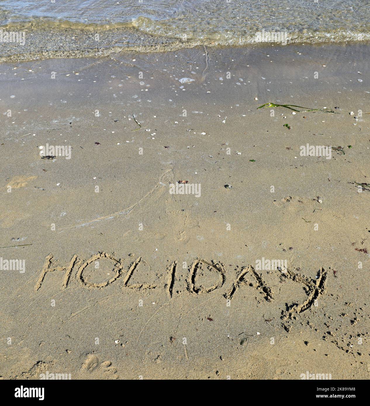 June written on sand summer hi-res stock photography and images - Alamy