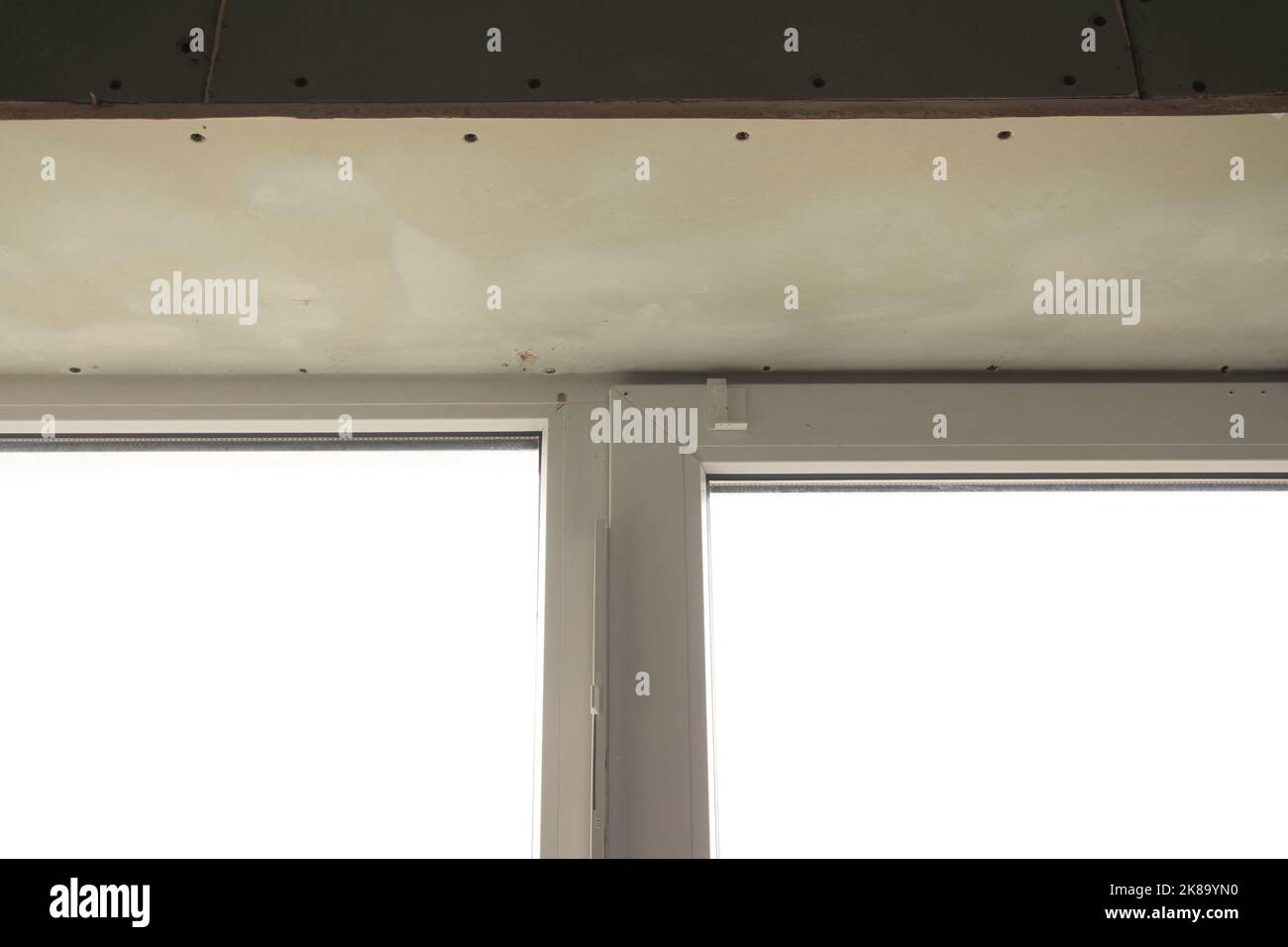 windows with plasterboard slopes, moisture and fungus, apartment ...