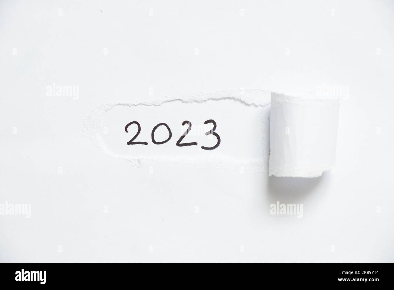 2023 written on white torn paper, happy new year 2023 Stock Photo - Alamy