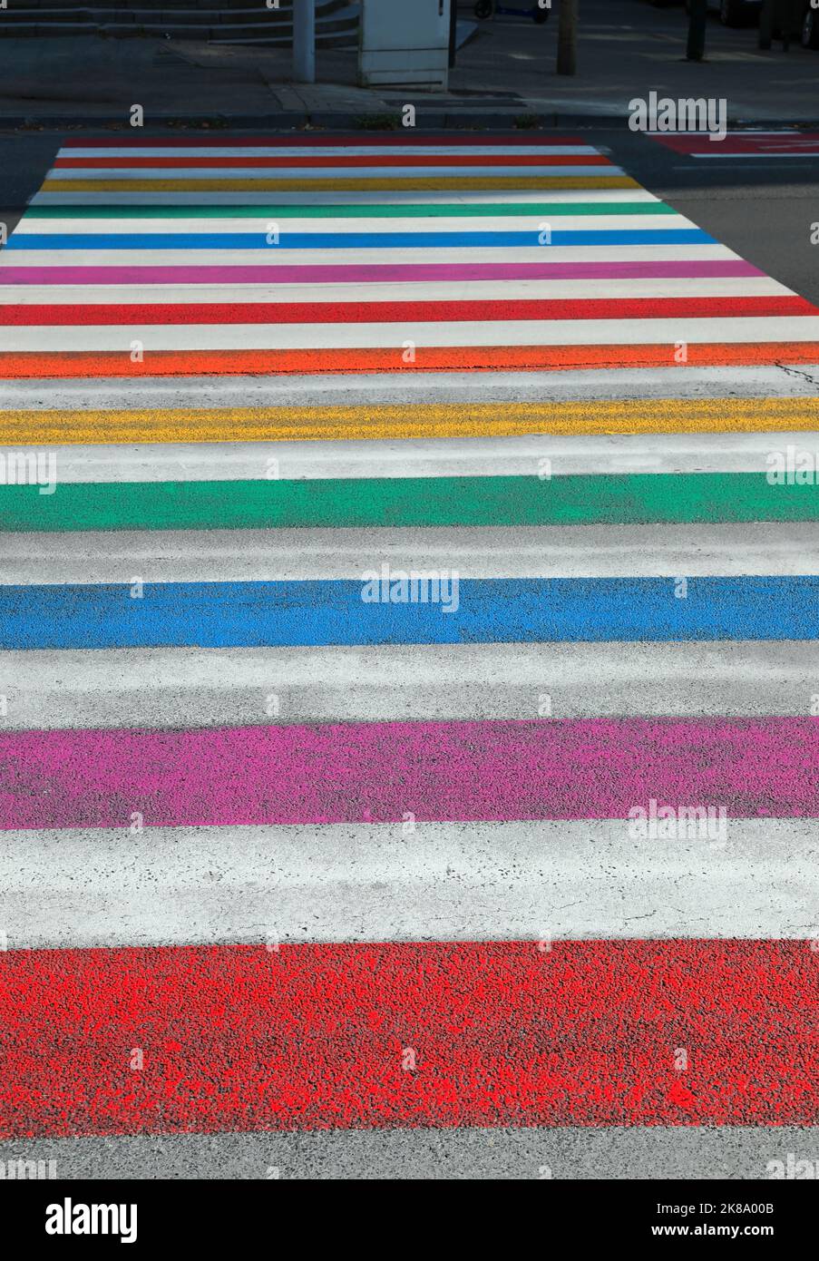 pedestrian crossing with many colors on the asphalted road Stock Photo ...