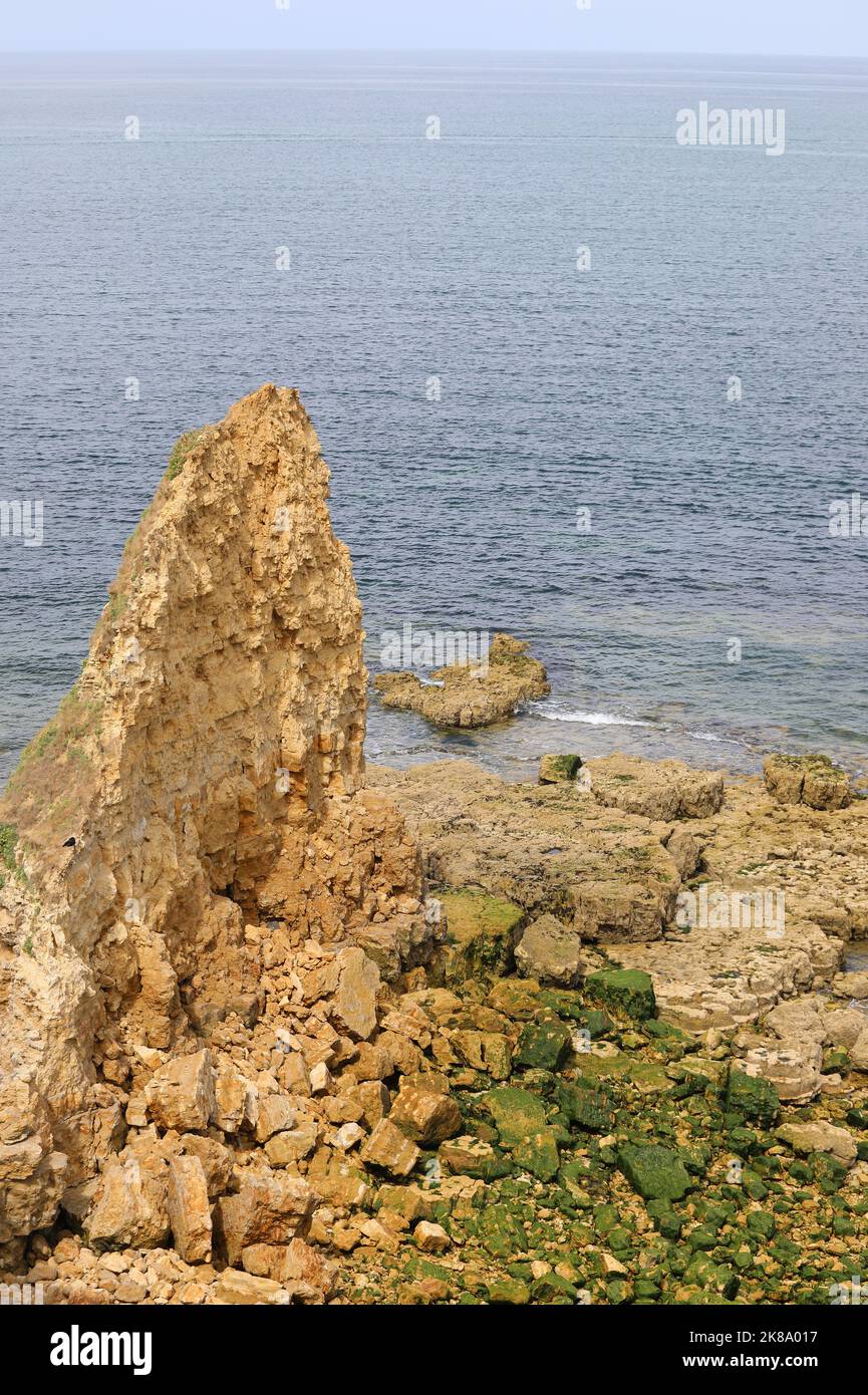 rock collapsed due to erosion due to wave motion by the sea Stock Photo ...