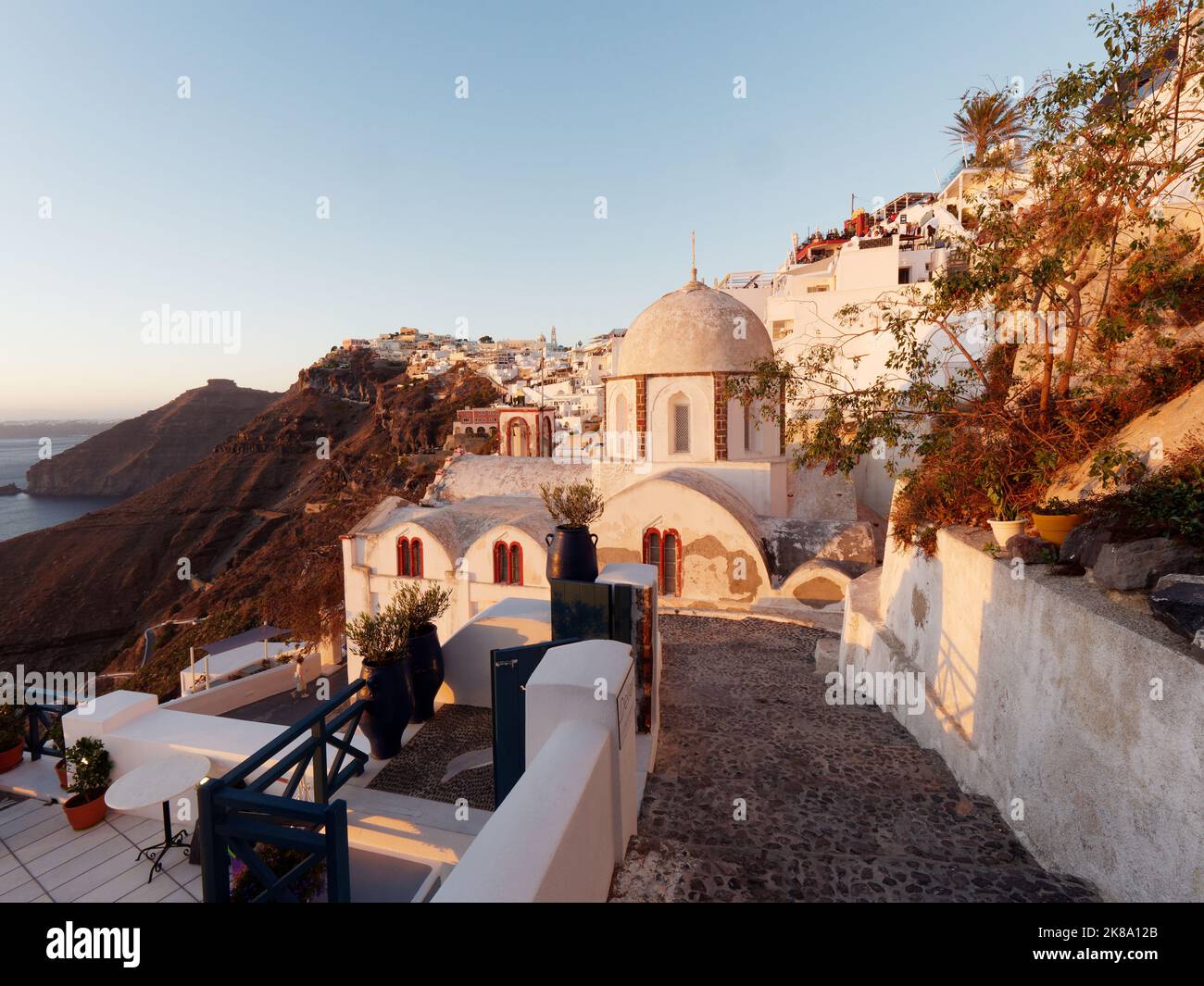 St John the Theologian church in Fira under the evening sun with Skaros ...