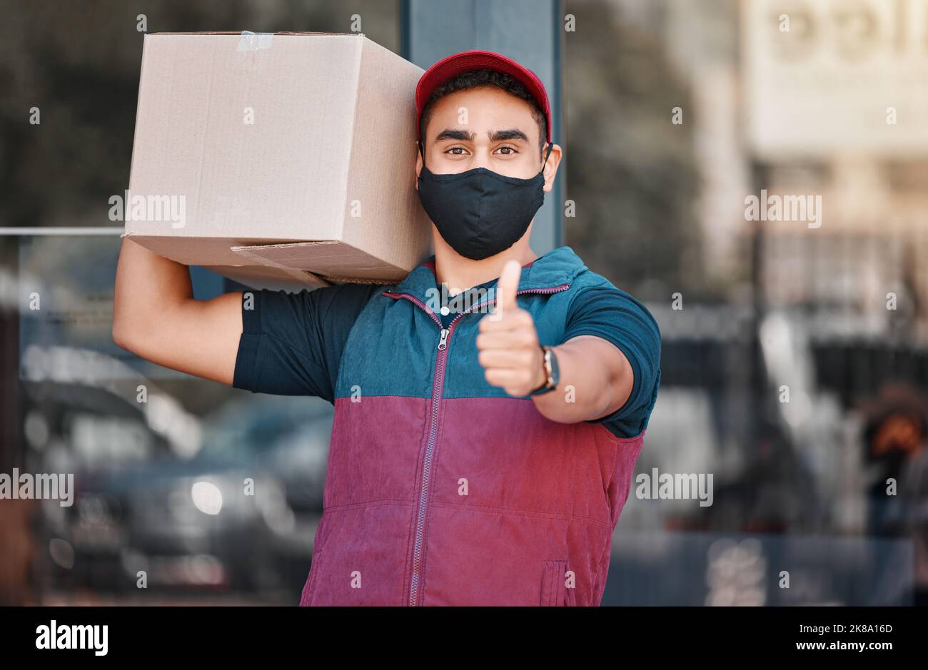Thumbs up, box and man with face mask for delivery with export or ...
