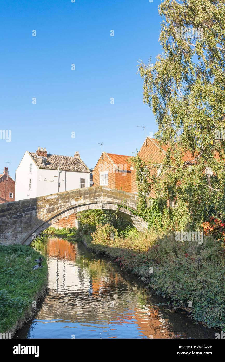 The listed Packhorse Bridge over the river Leven in Stokesley, North ...