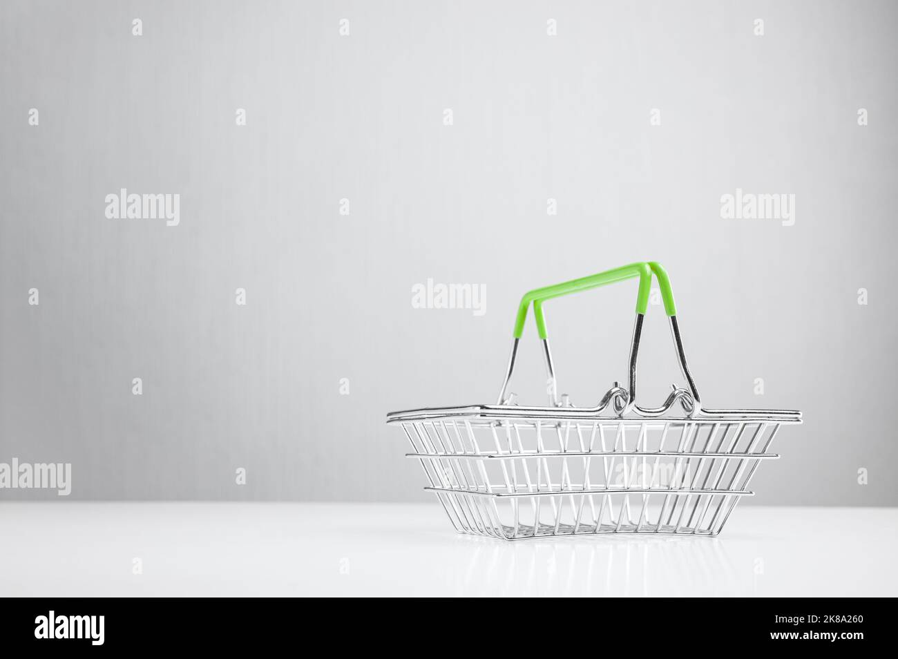 Empty shoping basket on grey background. low income. low or no sales ...