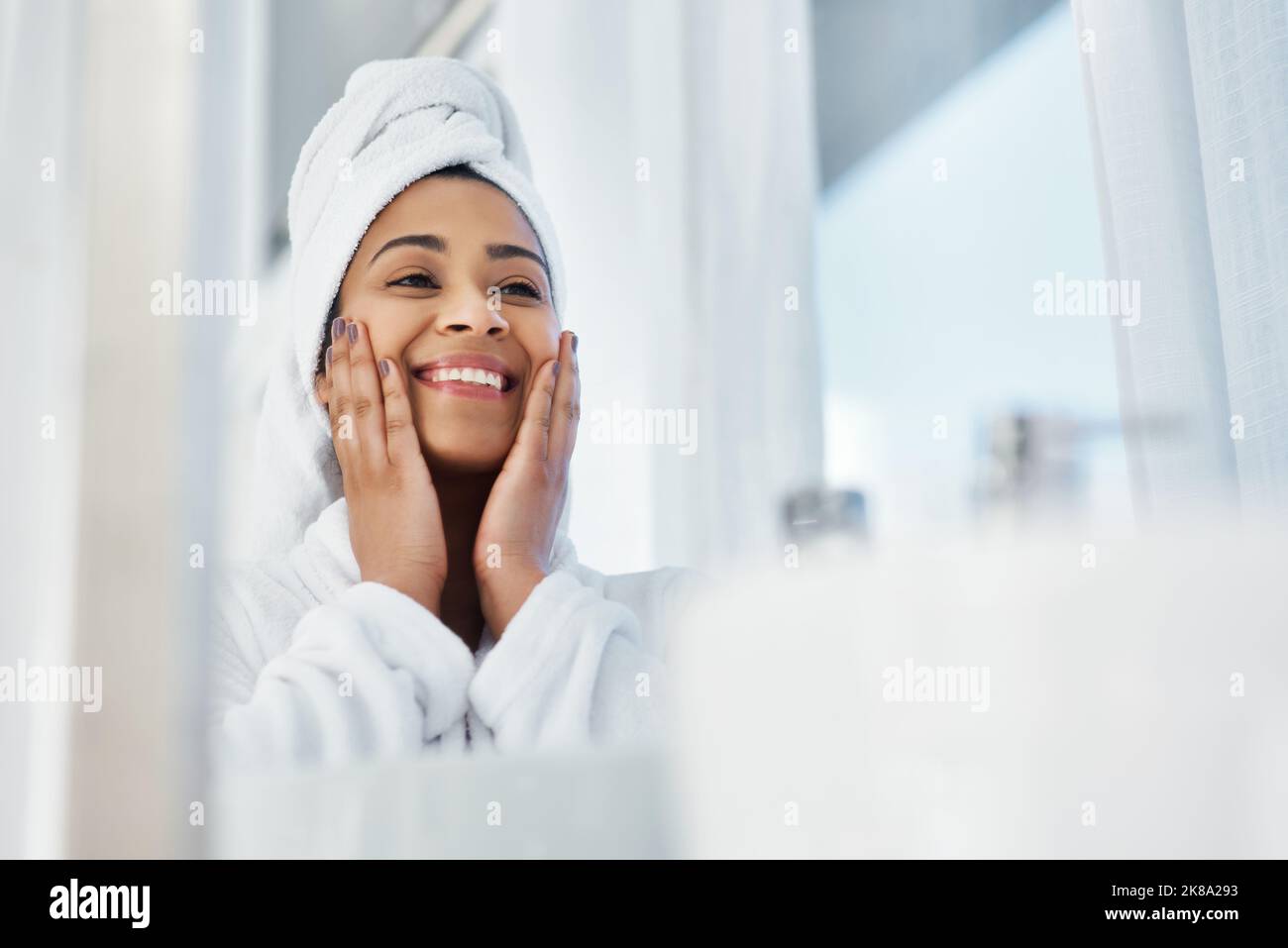 Mirror, mirror on the wall. a young woman going through her beauty ...