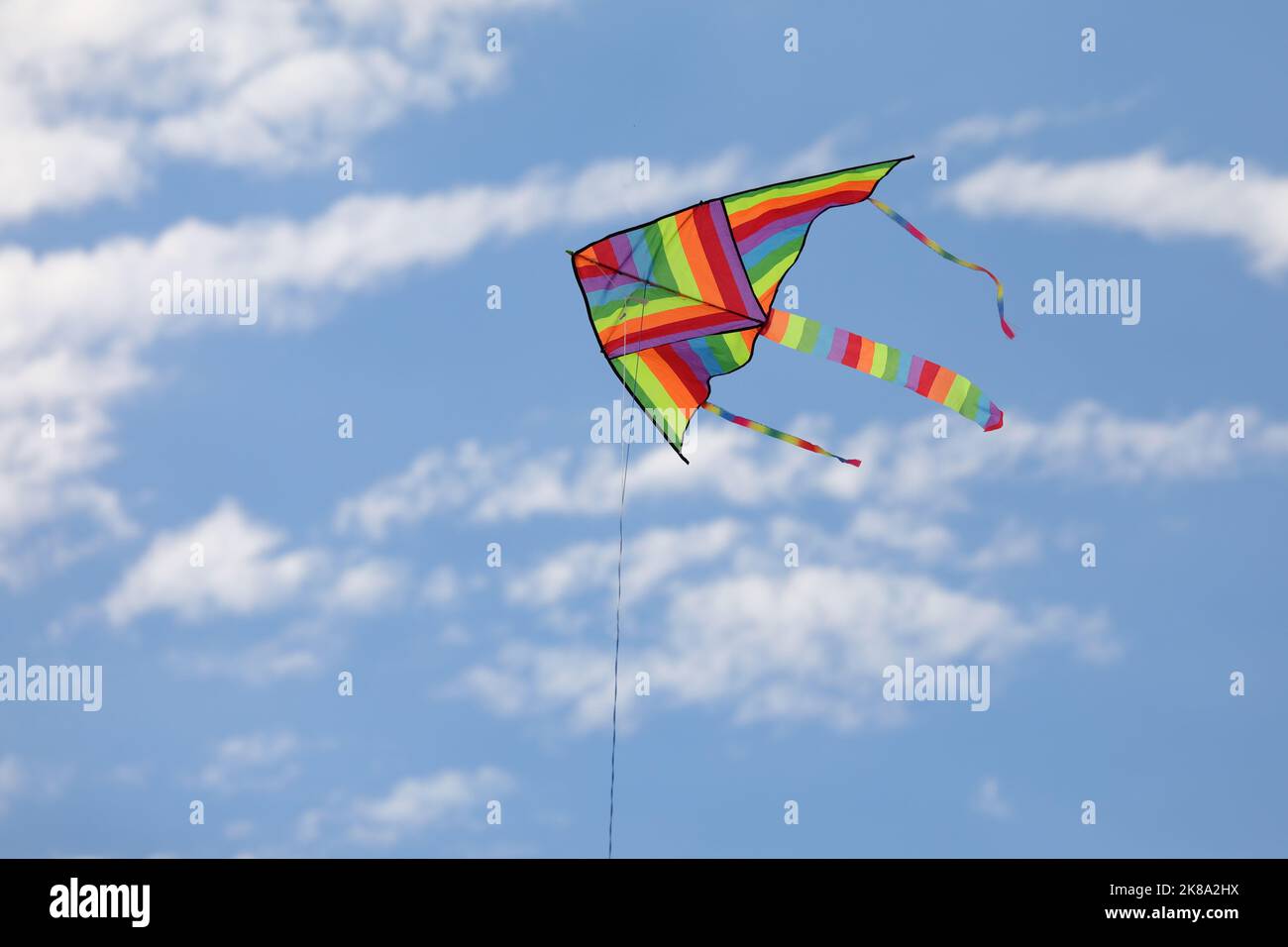 colorful kite with the multi colors of the rainbow flies free Stock ...
