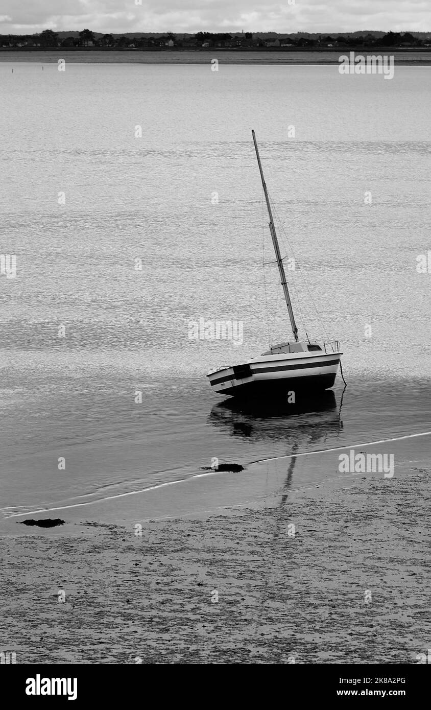 beached boats stranded in quicksand by the sea at low tide Stock Photo ...