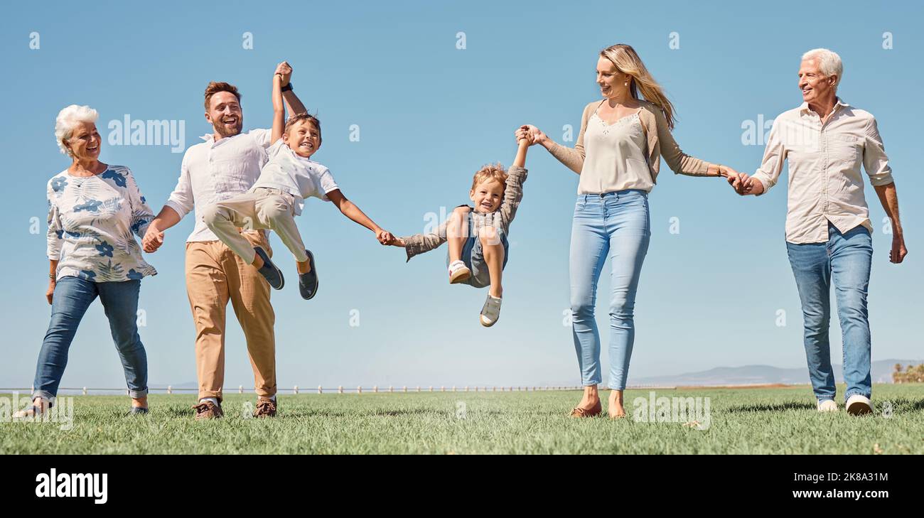 Lift, happy family and summer walk in a field, play and fun in nature ...