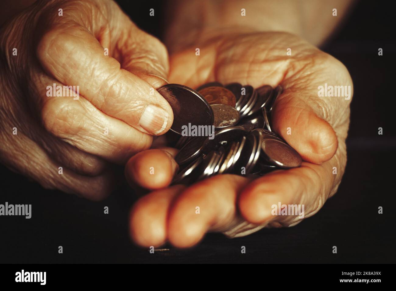 Old coin hand hi-res stock photography and images - Alamy